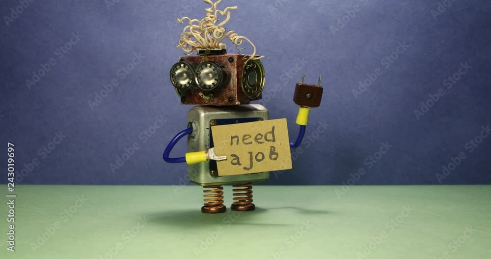 The robot wants to get a job. Funny toy robot walking with a cardboard ...