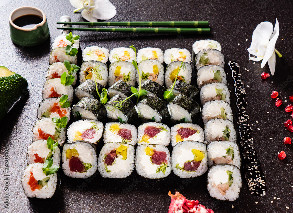 Rainbow Sushi set with salmon, eel, tuna, avocado, royal prawn, cream ...