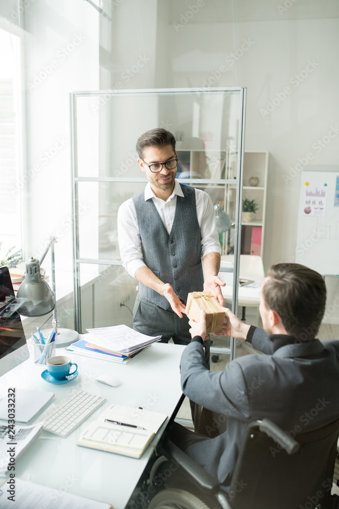 Disabled businessman sitting in wheelchair near his workplace and ...
