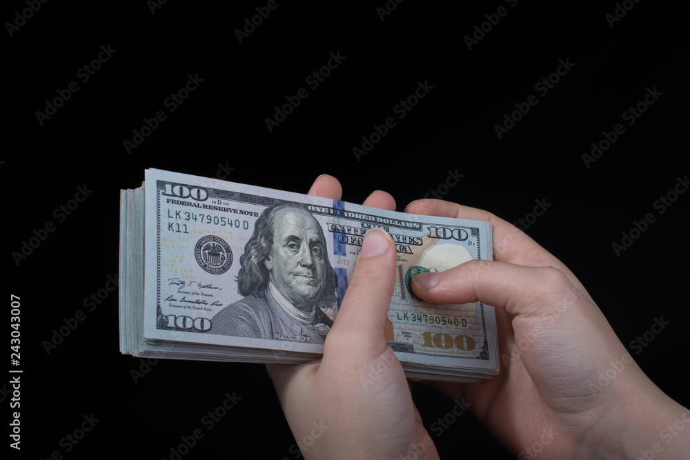 Hand holding American dollar isolated on white background Stock Photo ...