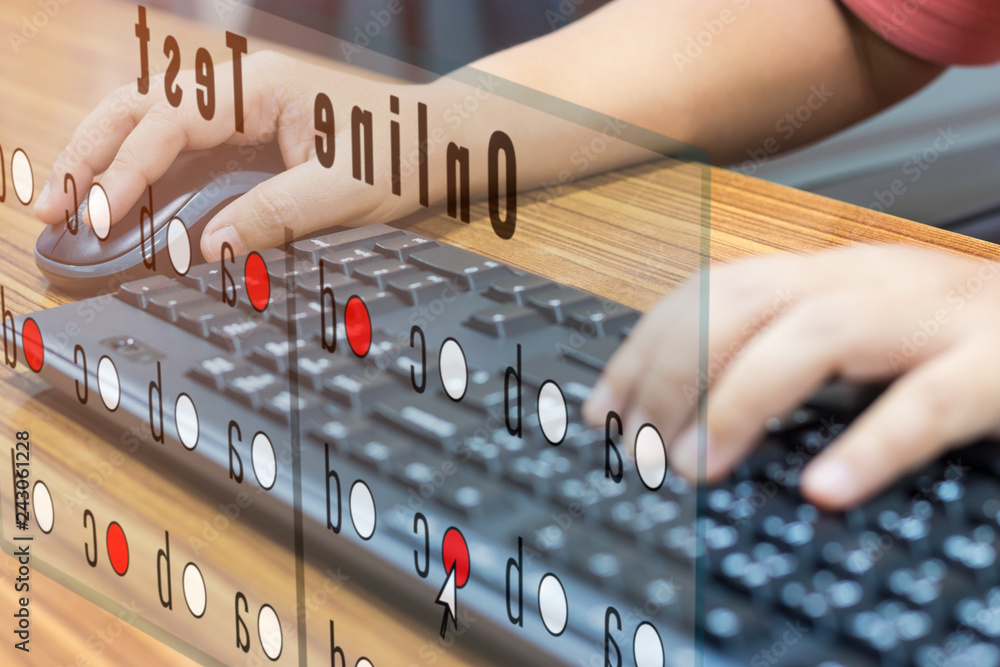Dry hands of adult student using mouse and keyboard on wood table to do ...