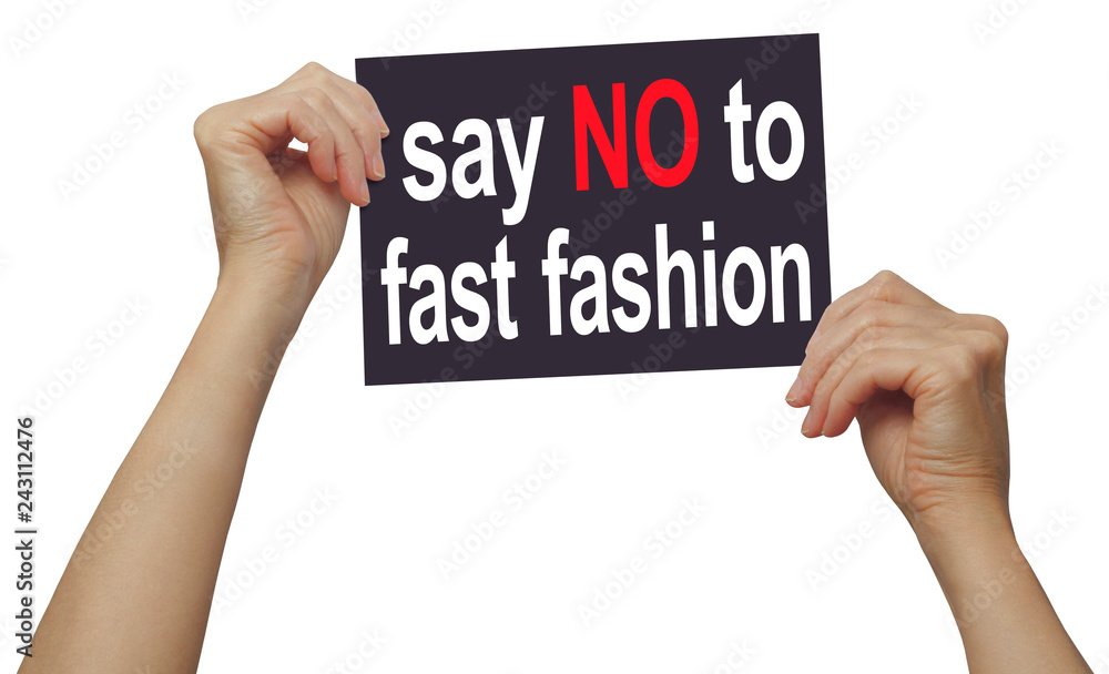 Say NO to fast fashion campaign sign - female holding up a placard with ...