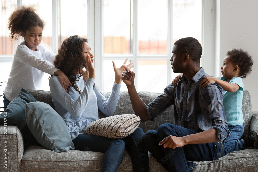 Fotografia do Stock: Upset african kids making black parents stop ...
