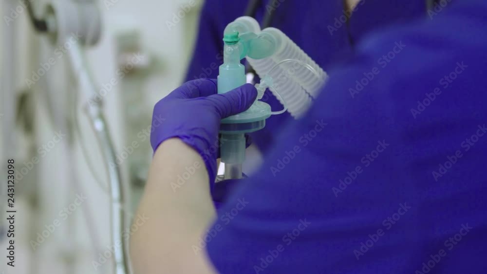 Inserting a hose into a intubation tube close-up during the general ...