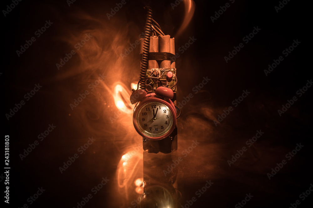 Image of a time bomb against dark background. Timer counting down to ...