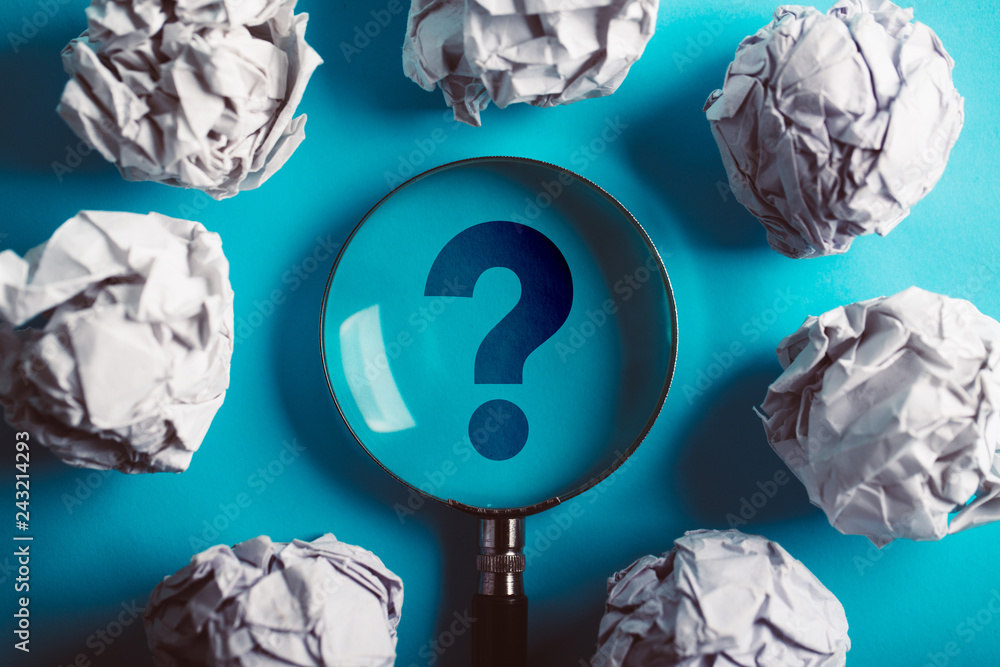 Question Mark Magnifying With Crumpled Paper Ball On Blue Stock Photo ...
