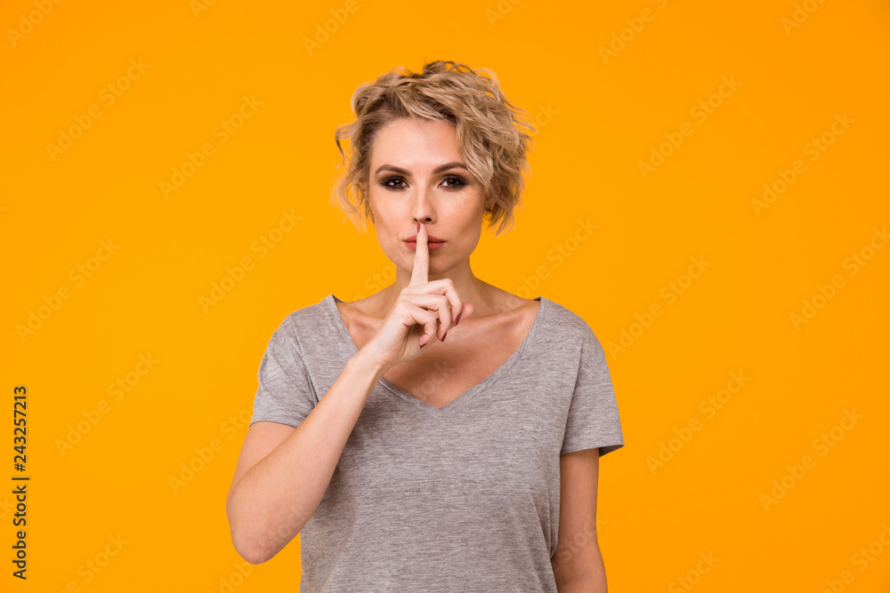 Silence. Woman asking for silence or secrecy with finger on lips hush ...