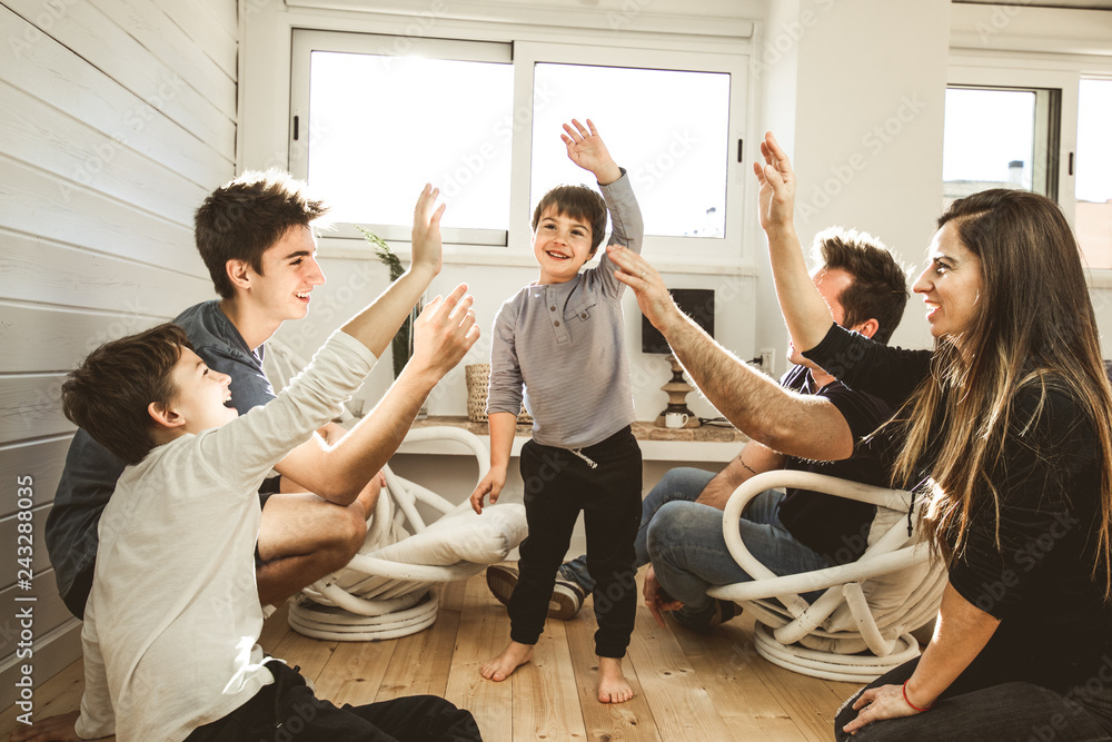 A happy family at home with fun and positive expression. Lifestyle of ...