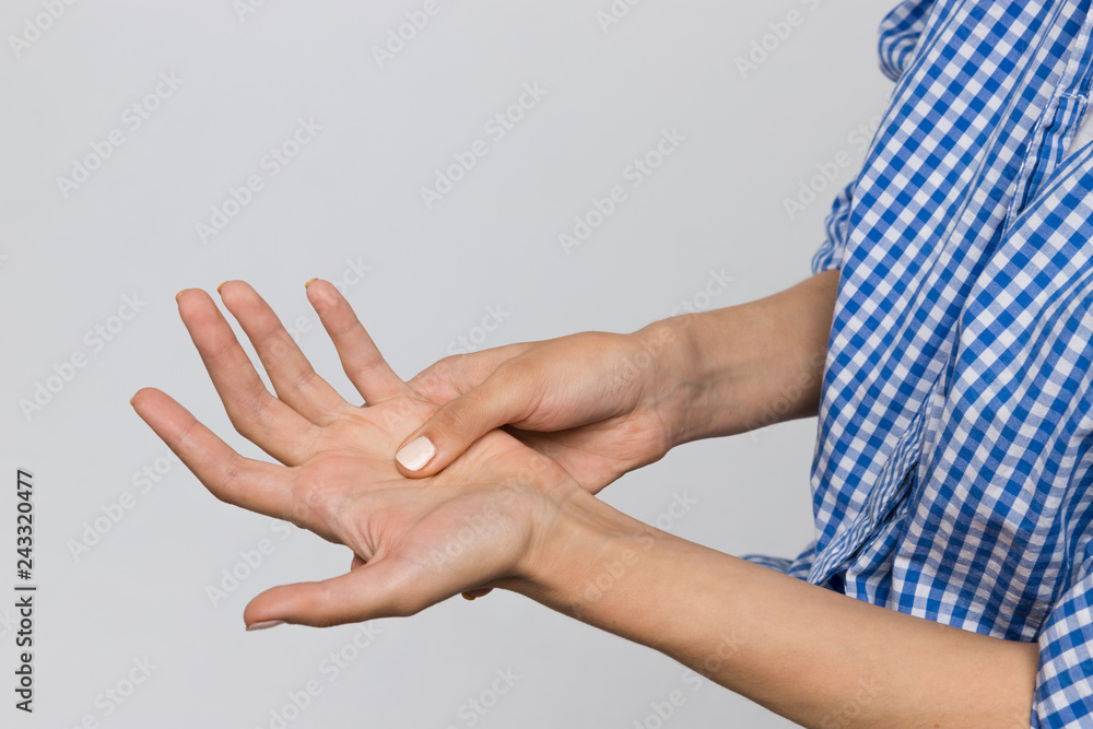 Close-up shot of woman suffering from pain if arms, weakness and ...