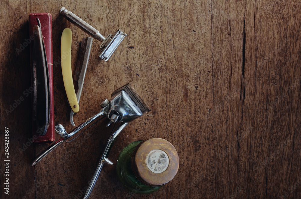 Vintage barber shop tools on wood texture background Stock Photo ...