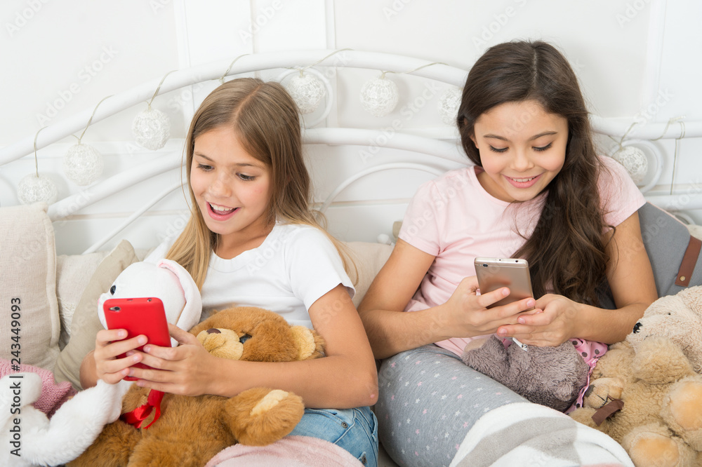New technology. Happy little children with mobile phone. Ordering gifts ...