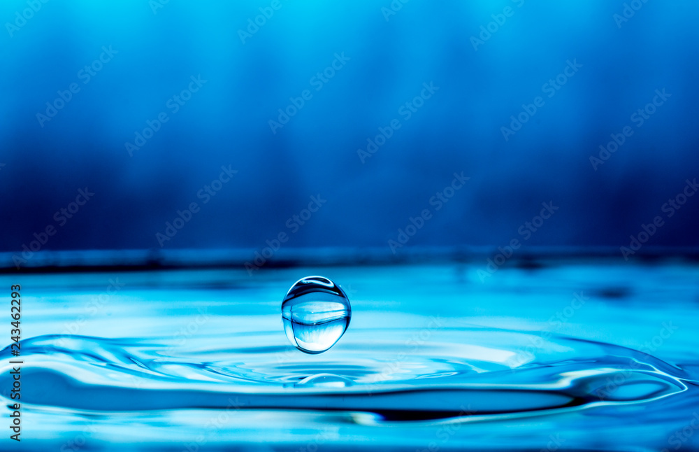 rain drop falling on a body of water Stock Photo | Adobe Stock