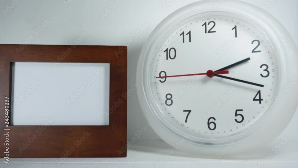 Lunch time. Close-up. White wall clock and picture frame on white ...