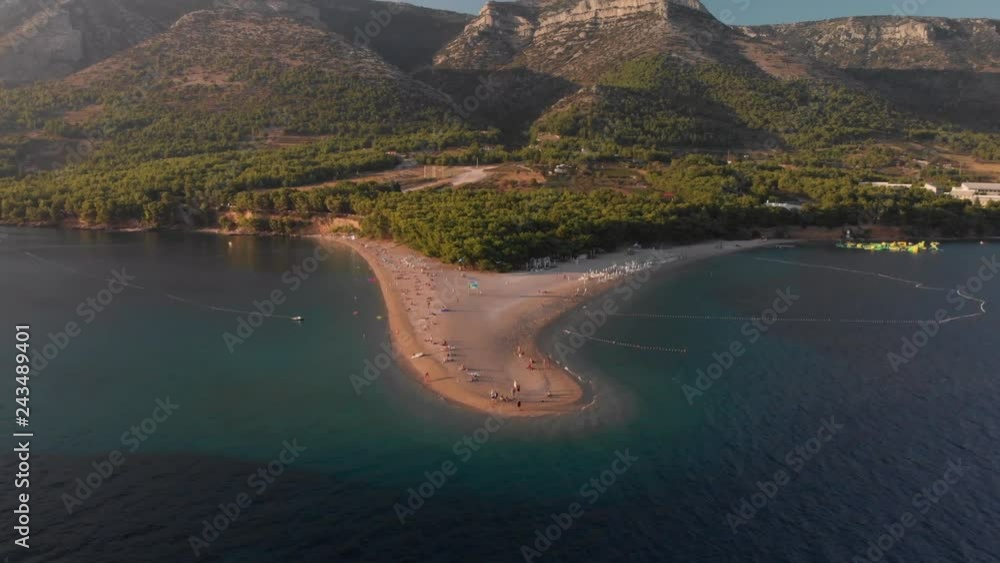 Slowly flying toward the beachhead of Zlatni Rat on the island of Brac ...