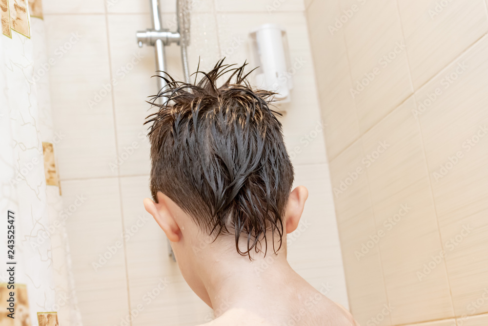 Hygienic procedures and healthy habits of a preteen boy - taking shower ...