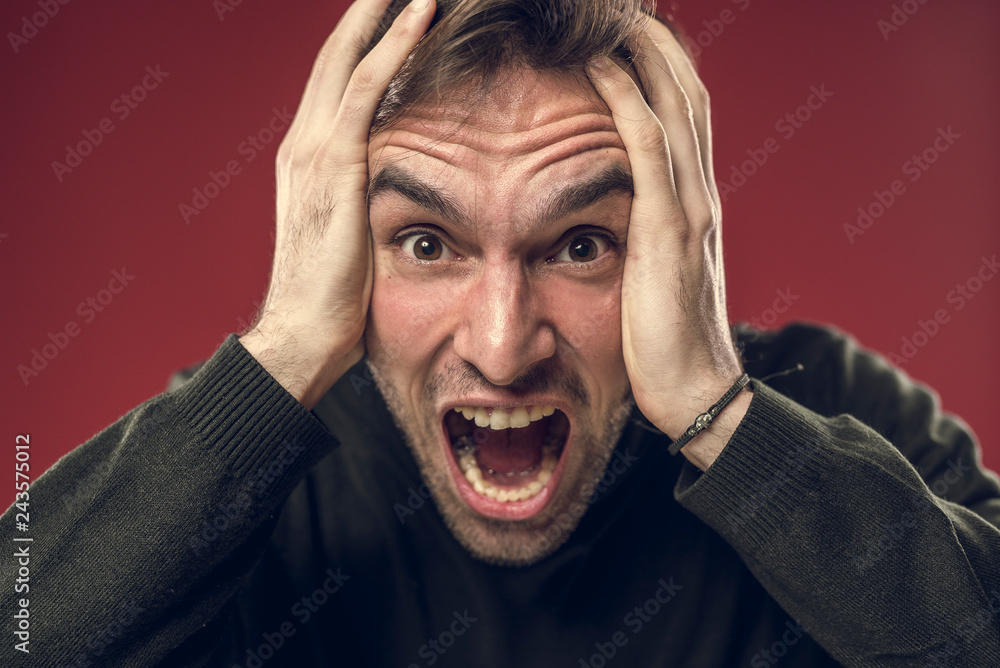 Frustrated and outraged young man shouting, overwhelmed and angry Stock ...