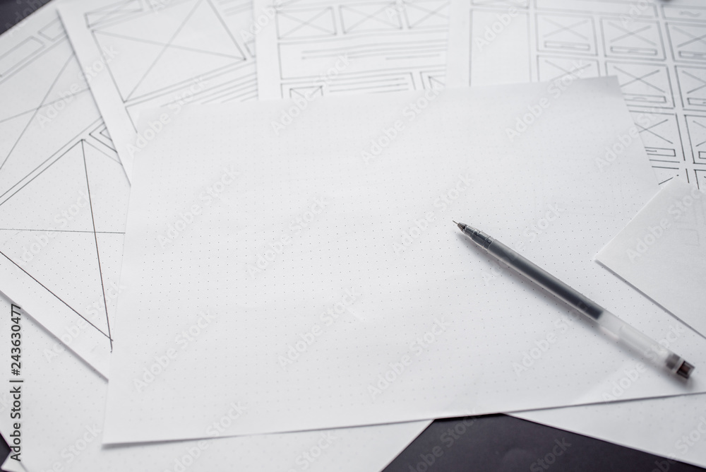 UX website designer drawing wireframe sketch of prototype, framework ...