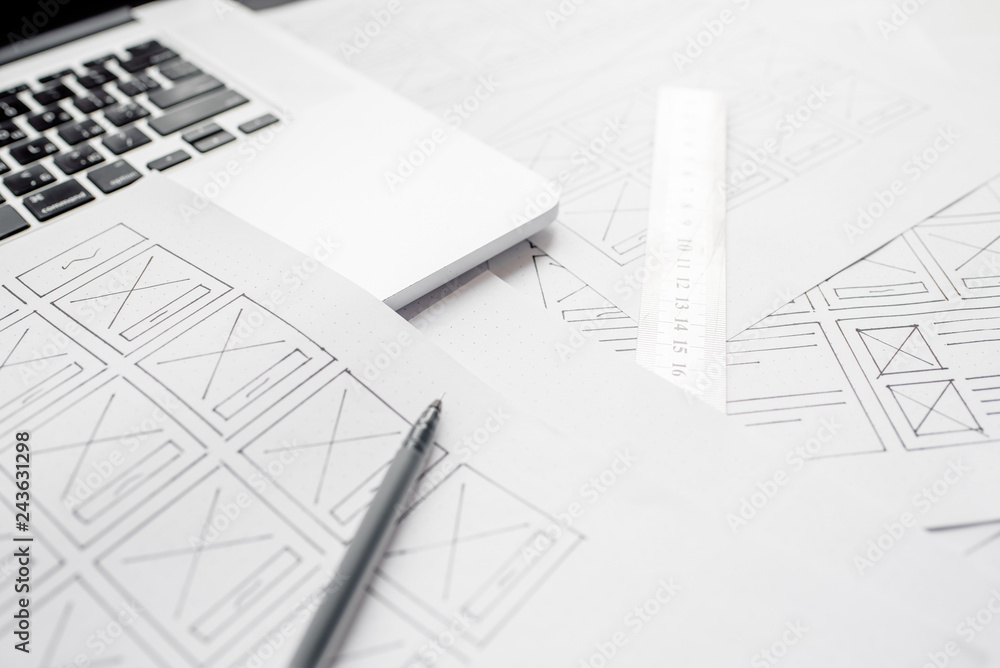 UX website designer drawing wireframe sketch of prototype, framework ...