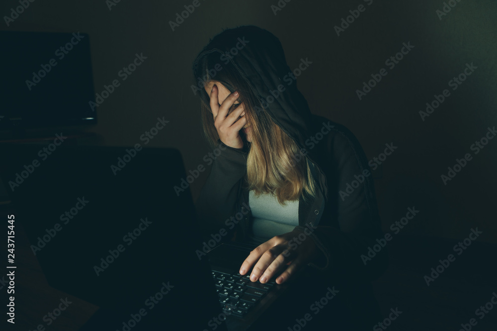 Teenager girl suffering internet cyber bullying scared and depressed ...