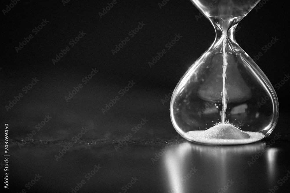 Hourglass as time passing concept for business deadline, urgency and ...