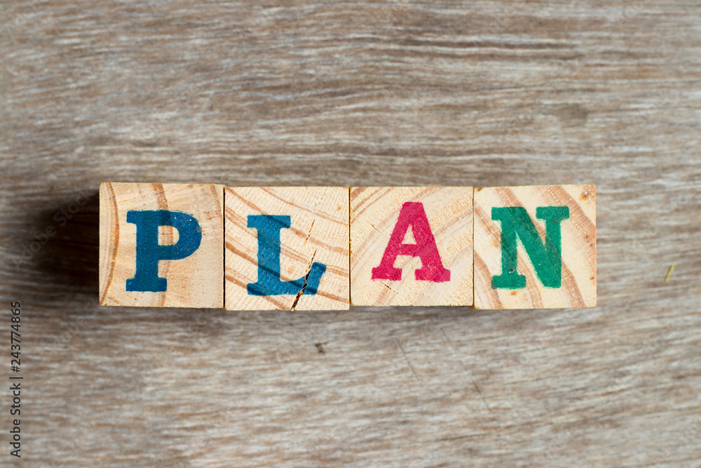 Letter block in word plan on wood background Stock Photo | Adobe Stock