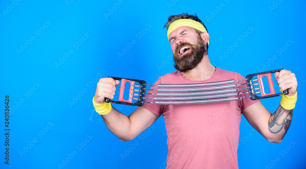 Athlete workout with expander. Improve your muscles with sport ...