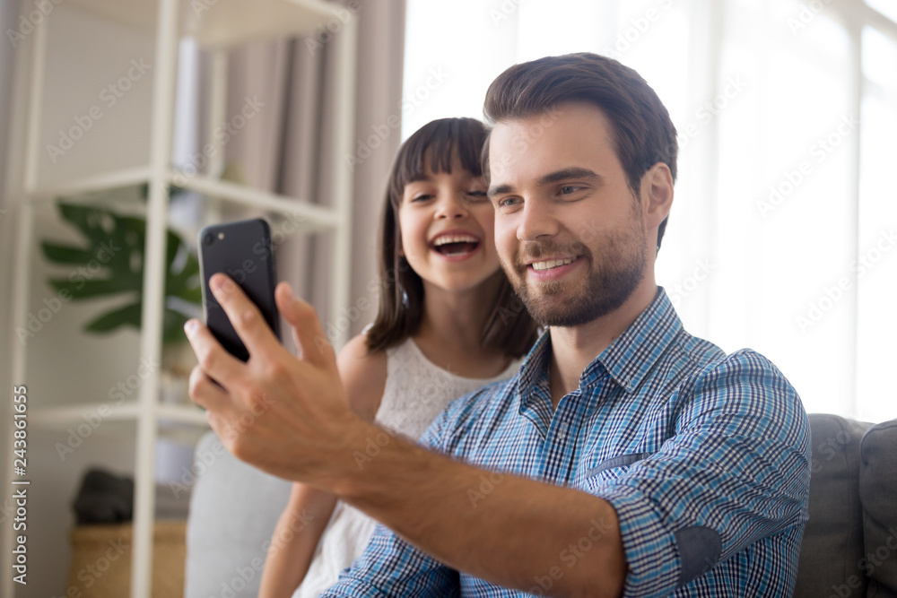 Smiling father taking selfie with cute kid on smartphone posing for ...