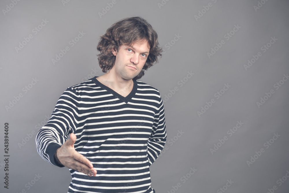 Welcome, nice to see you. Man in black and white striped sweater ...