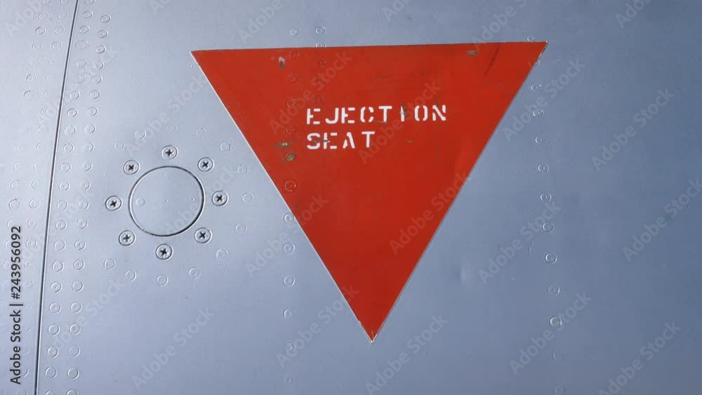Red triangle indicating position of ejection seat on fighter jet. F-104 ...