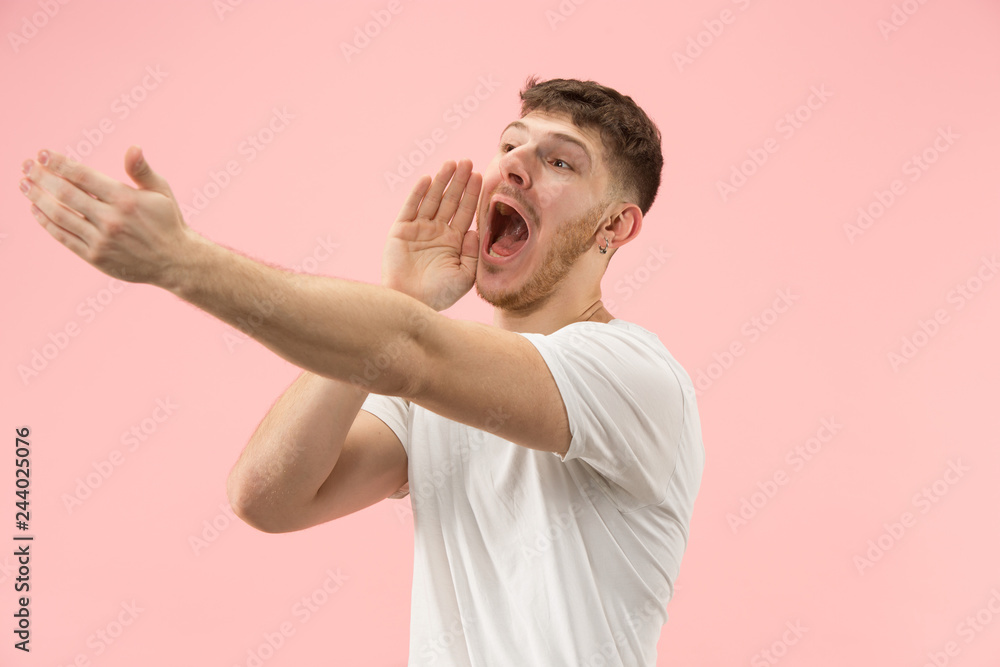 Fotografia do Stock: Do not miss. Young casual man shouting. Shout ...