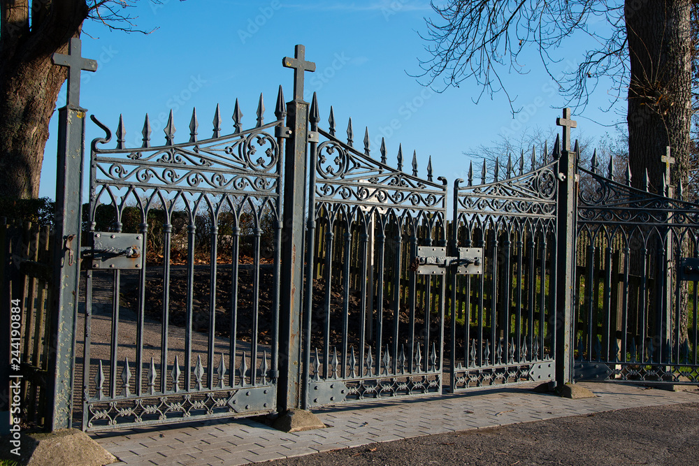 wrought-iron Gateway with small crosses at entrance to graveyard Stock ...