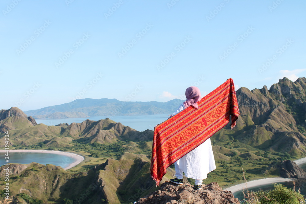 Hijab woman posing at the peak of Padar Island, Labuan Bajo, Indonesia ...