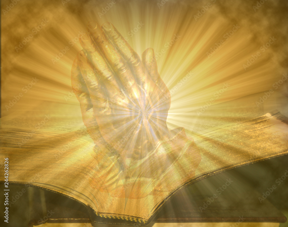 Praying Hands on Open Lighted Bible Stock Photo | Adobe Stock