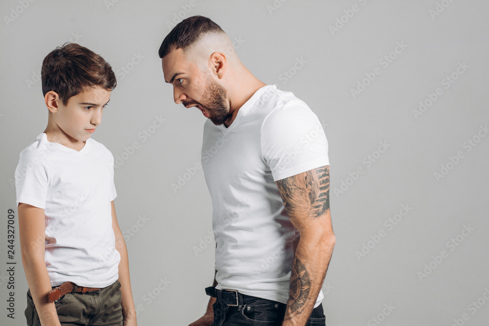 furios dad shouting at his child. reaction on bad behavior. close up ...