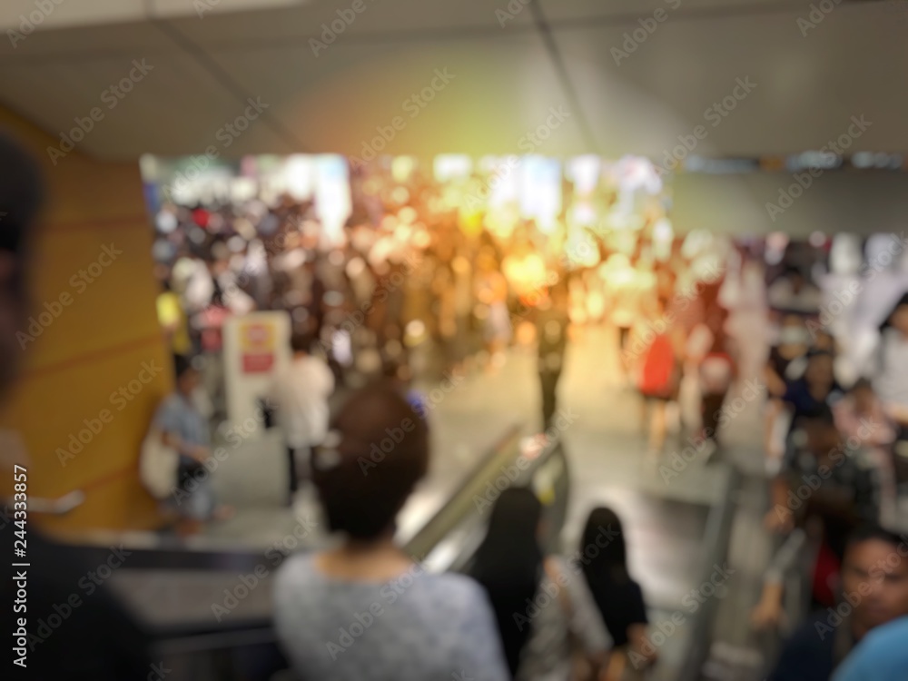 blurred image of Crowded station with people and passenger standing ...