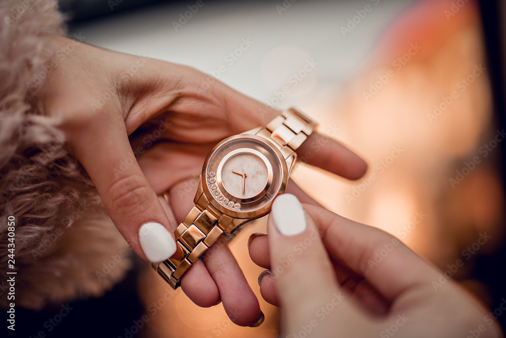 Very beautiful golden watch on woman hand Stock Photo | Adobe Stock