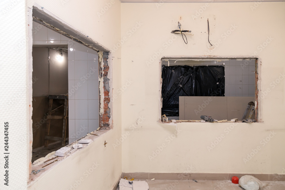 Repair and replacement windows in office building, destroyed window ...