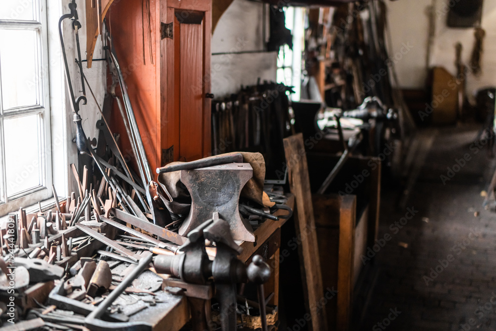 Vintage tools on a bench lit by a window, vice, gunsmith, gun, smith ...