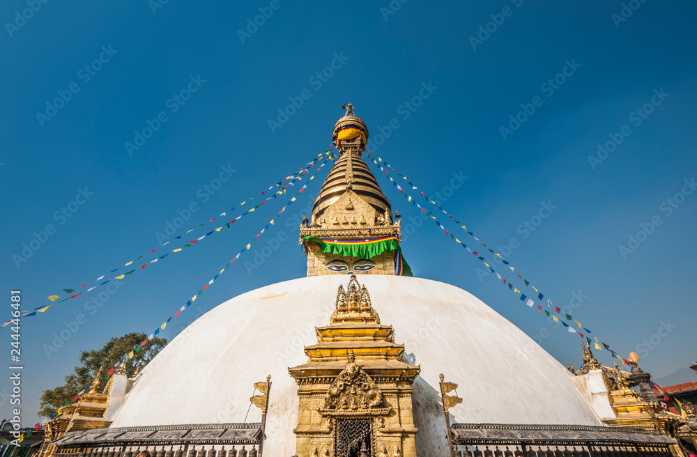 The whitewashed dome and gold spire of Swayambhunath Stupa Kathmandu ...