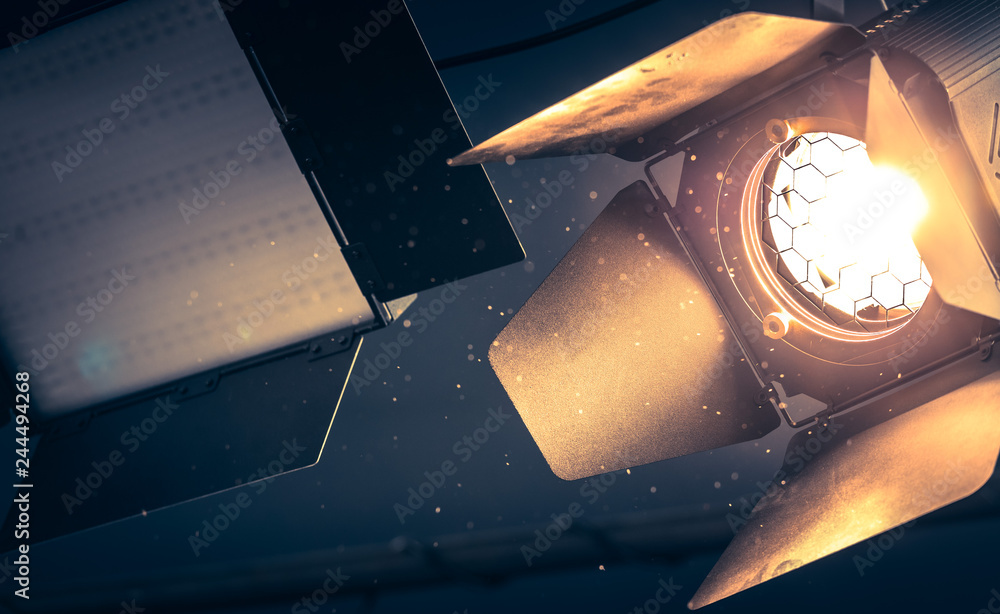 Professional orange studio spotlight in a TV studio. Lighted dust ...