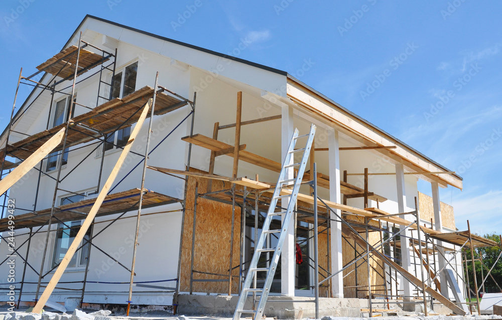 House renovation with wall insulation, plastering, paiting walls. House ...