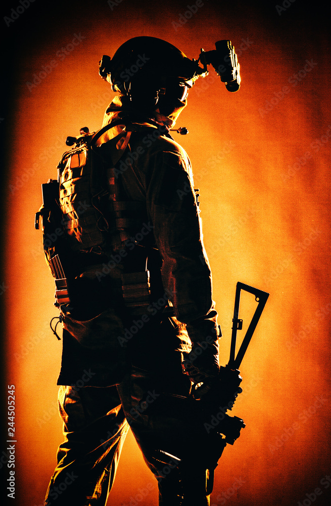 Army special forces soldier in tactical ammunition, night vision device ...