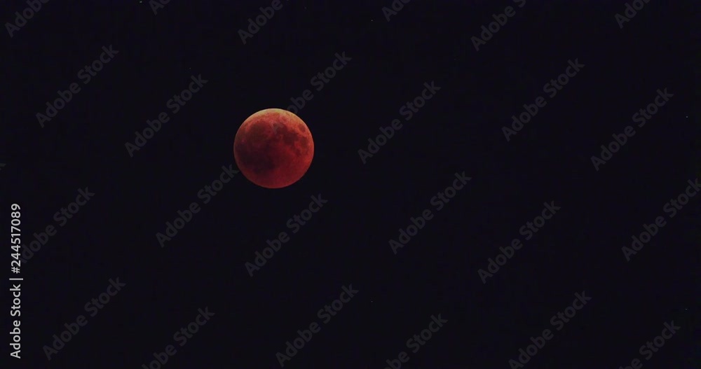 Full red moon by night. Total Lunar eclipse with moon turning red cause ...
