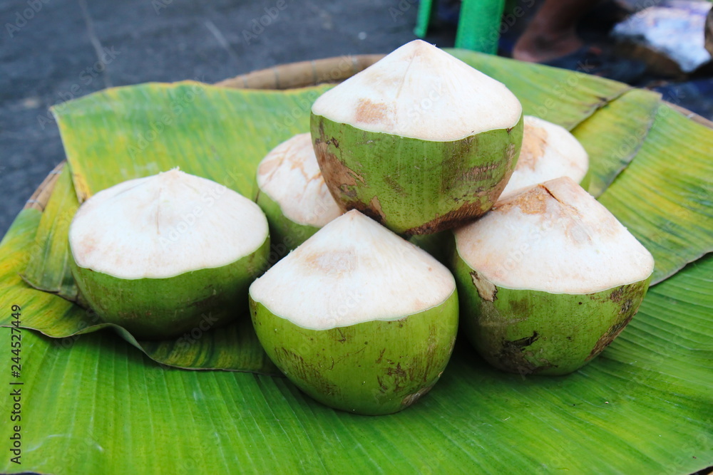 Green Coconut. Coconut background. Pile of Coconut Some cuts in half to ...