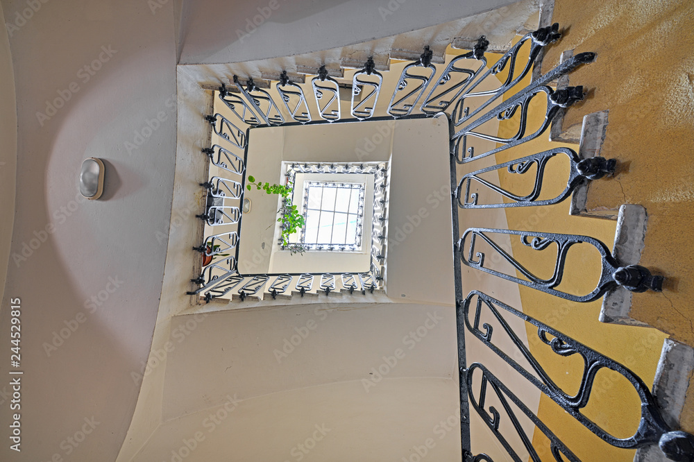 Spiraling staircase in an abandoned road side hotel. Ancient roman ...