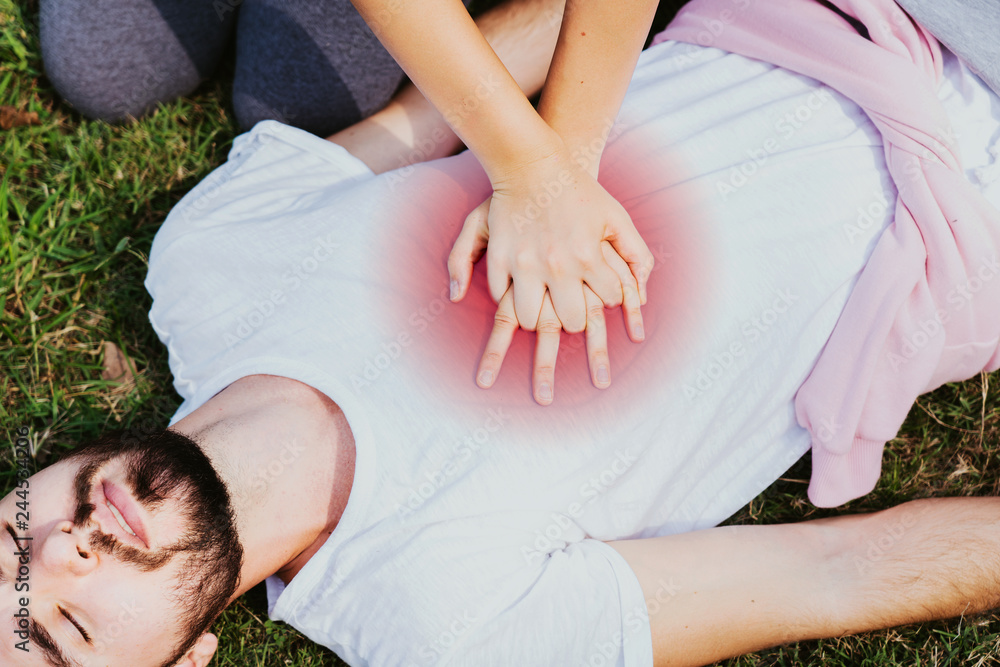 Hands are pressing to the chest. First Aid by Basic Heart Pump, a man ...