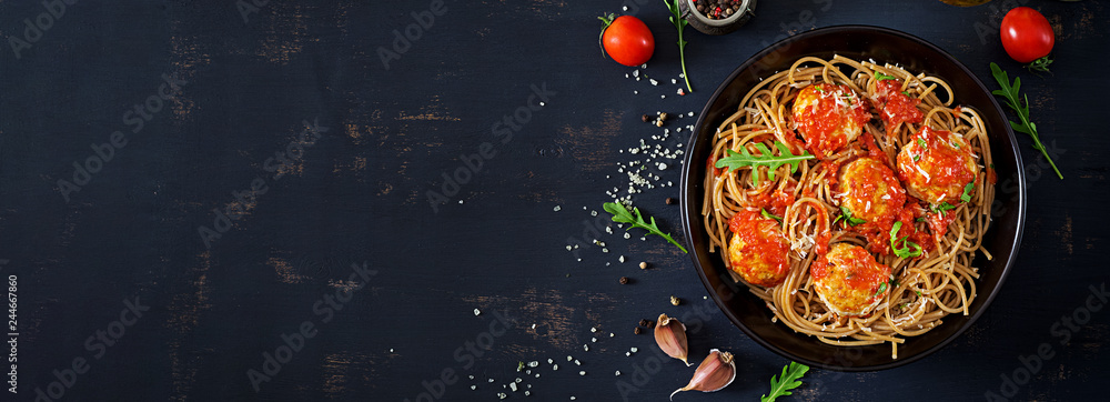 Italian pasta. Spaghetti with meatballs and parmesan cheese in black ...