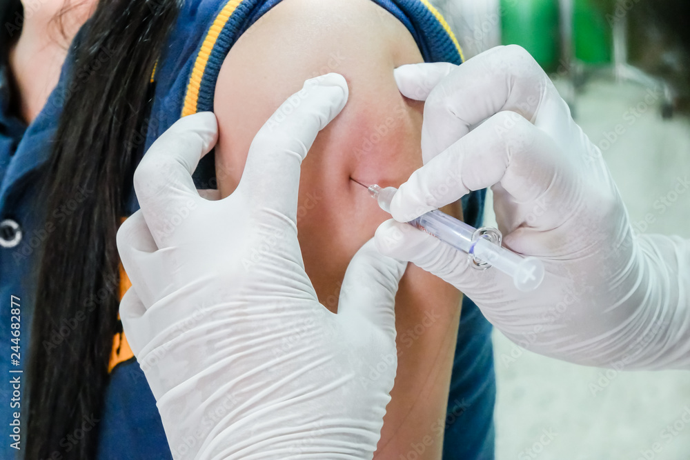 nurse doctor giving injection vaccine syringe in arm patient Stock ...