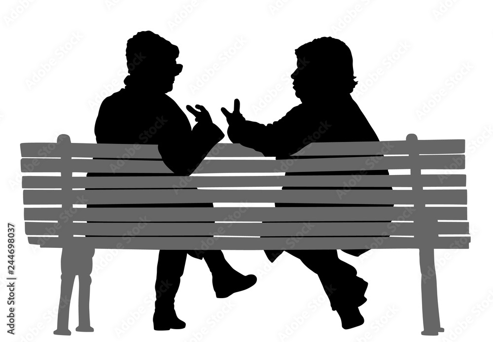 Women gossip at the break. Senior lady friends sitting on bench and ...