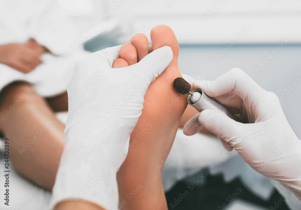 female legs close-up during a hardware manicure Stock Photo | Adobe Stock